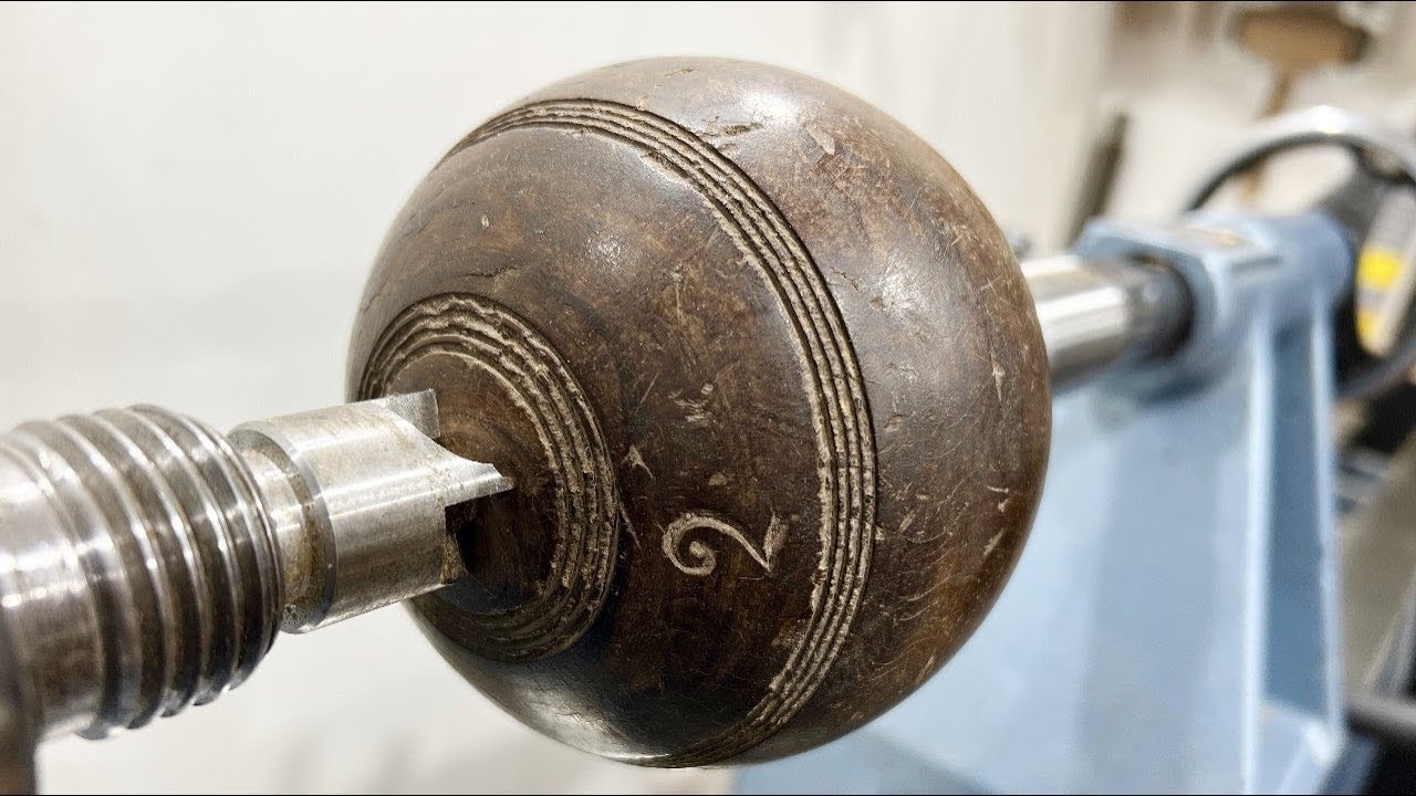 Watch what happens when this 200-year-old bowling ball hits the lathe