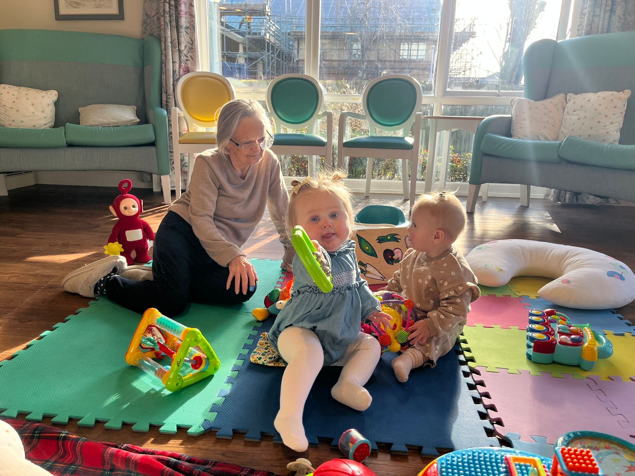 New intergenerational group brings babies and care home residents together