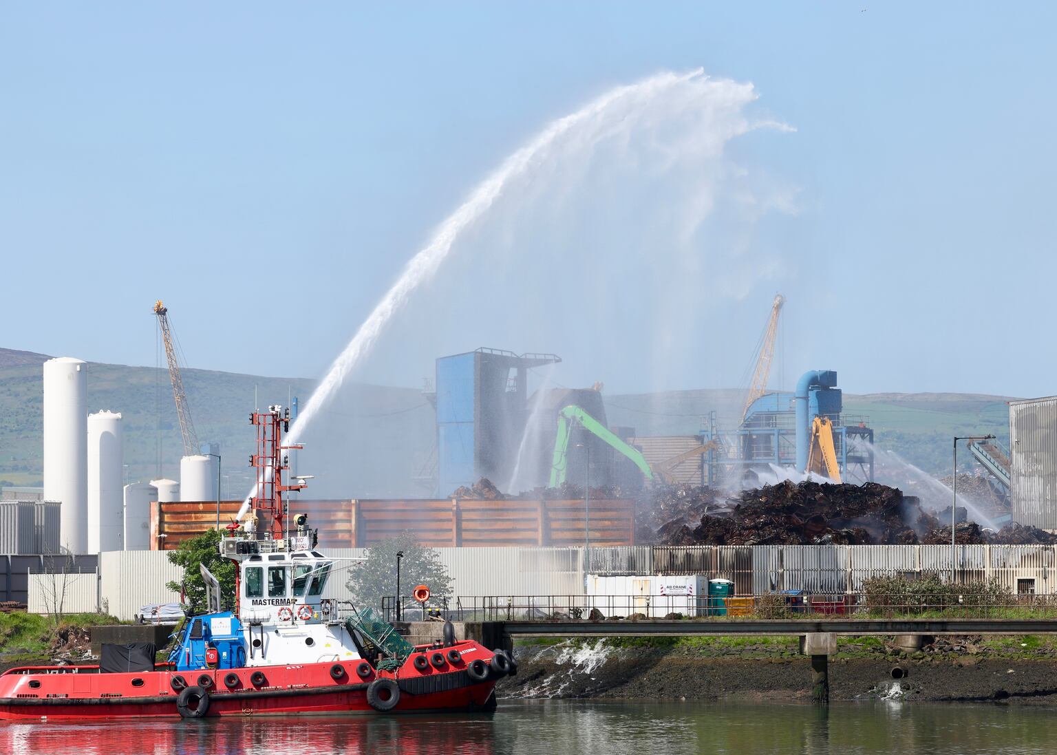 Firefighters remain at scene of Titanic Quarter blaze 24 hours after ...