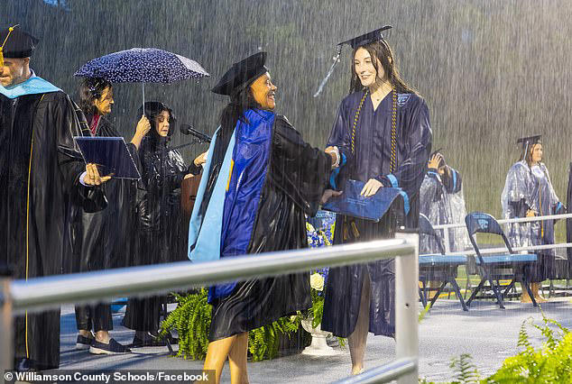 High school faces backlash as graduation is held in torrential downpour