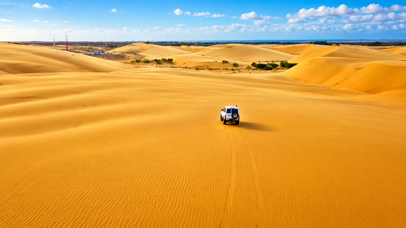 Where does this road lead through Coro’s endless sand dunes?