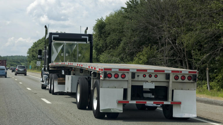 Why are some flatbed semi trailers curved?