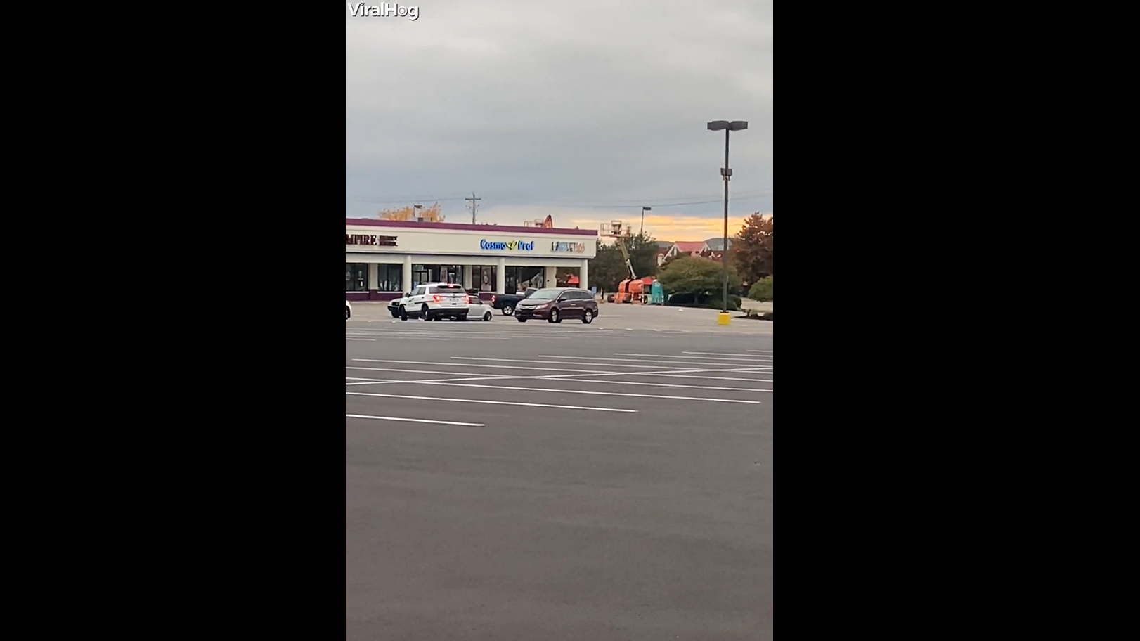Truck drives circles around police in parking lot