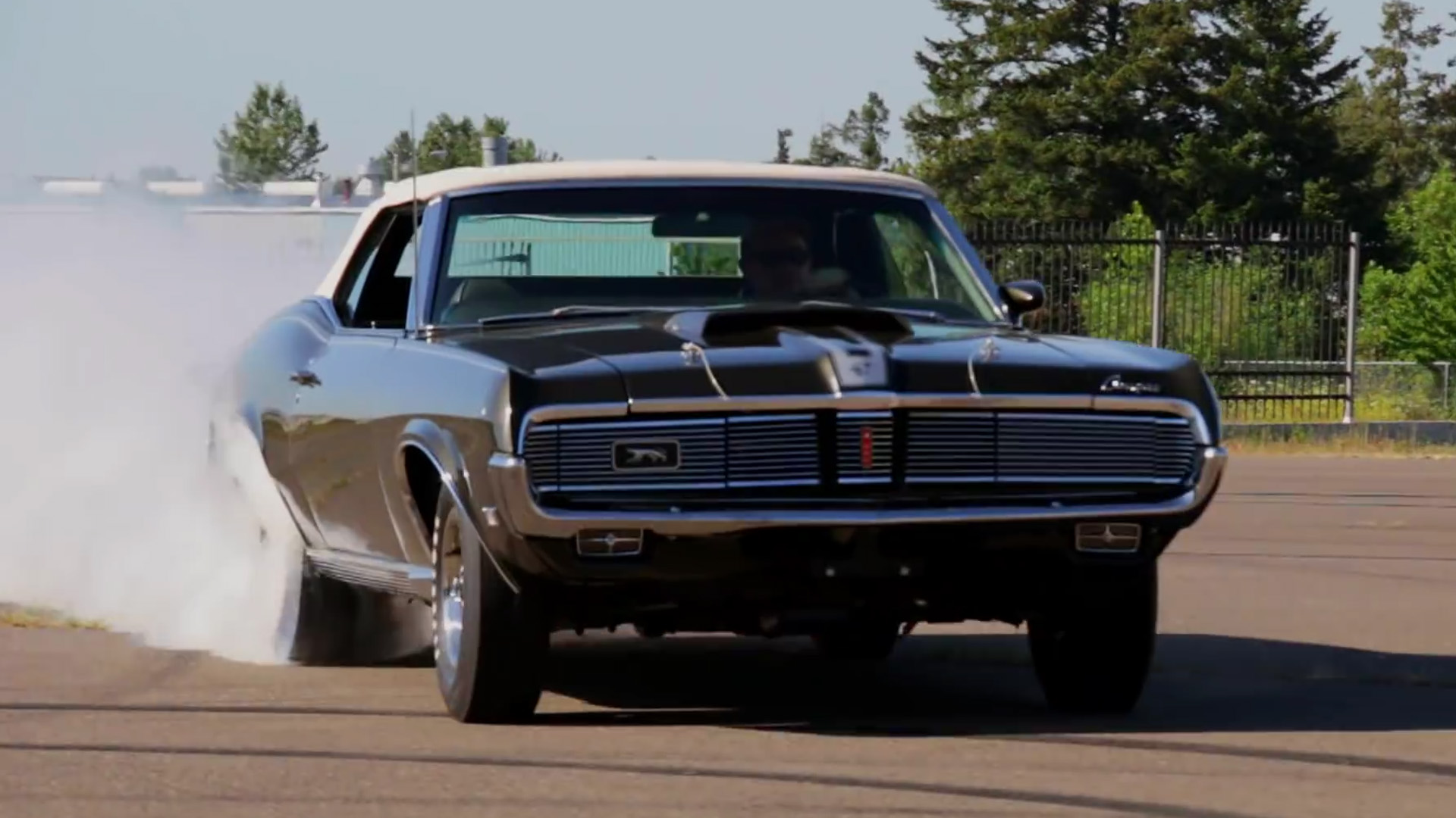 1969 Mercury Cougar XR7 shows aggressive 428 Cobra Jet power