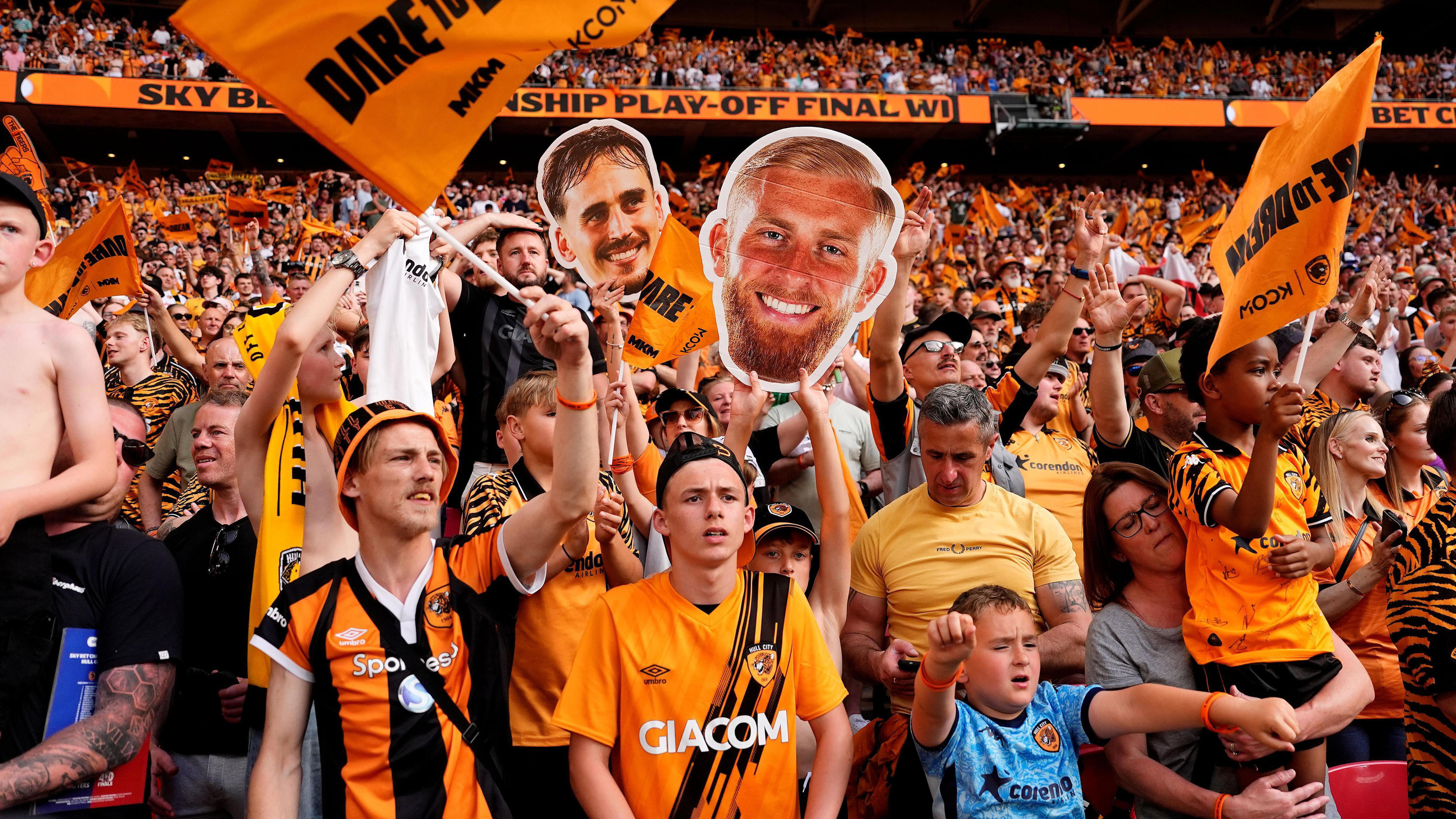 Hull City celebrating promotion with open-top bus parade