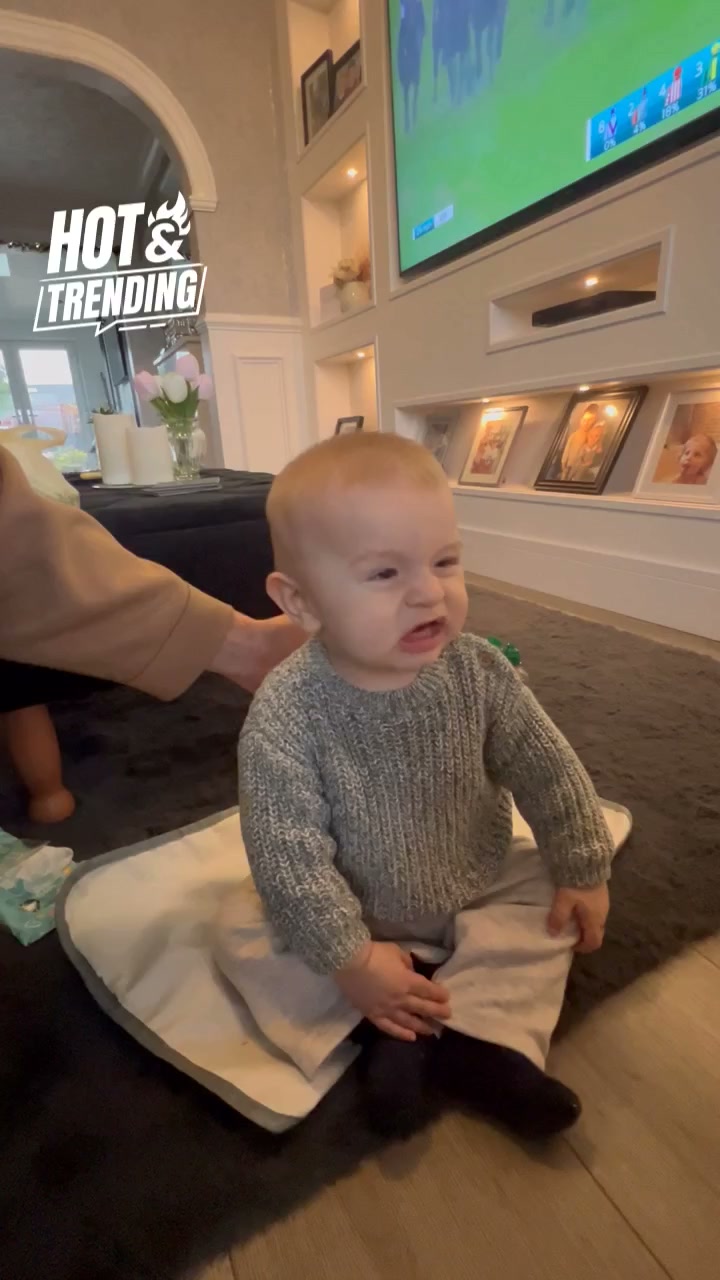 Young girl teaches her baby brother to say his first word