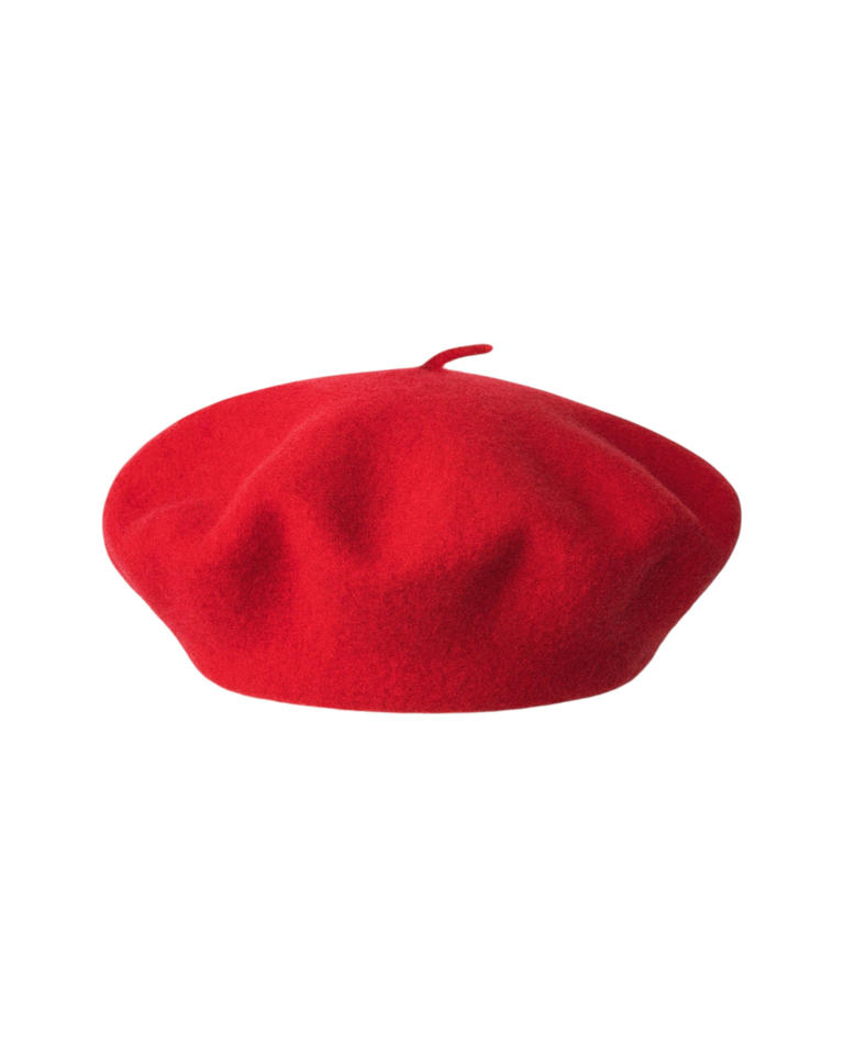 John Travolta says his viral berets are an 'homage to being a director'