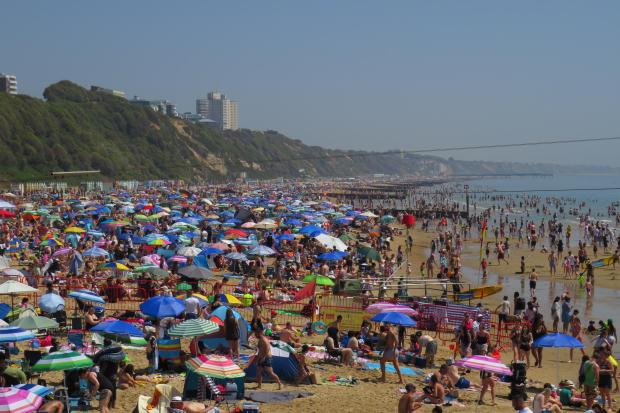 Pictures: Thousands flock to beach as temperatures hit 30 degrees