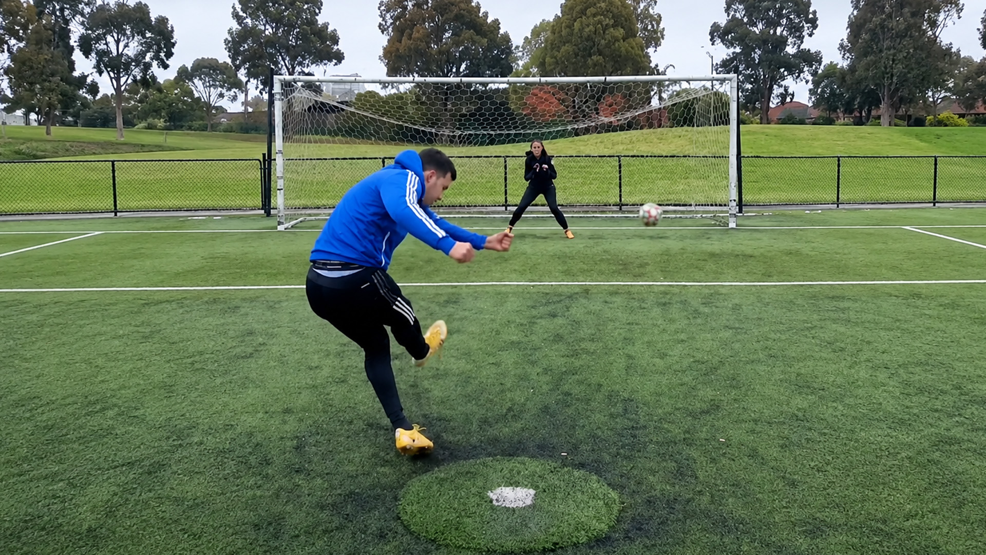 Proving her wrong with one powerful football shot