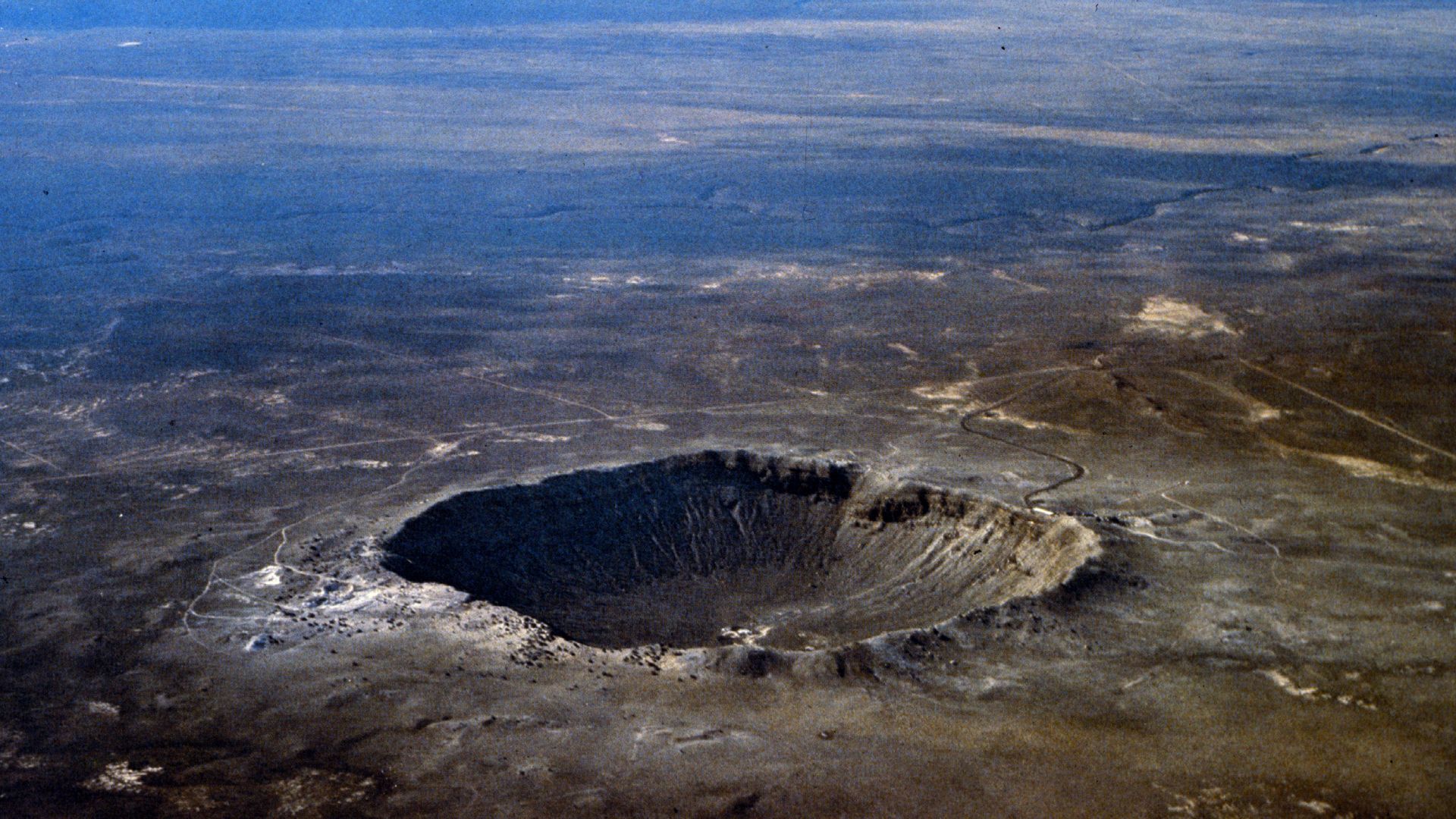 Asteroid crater discovery links early Earth life to possible Mars habitats