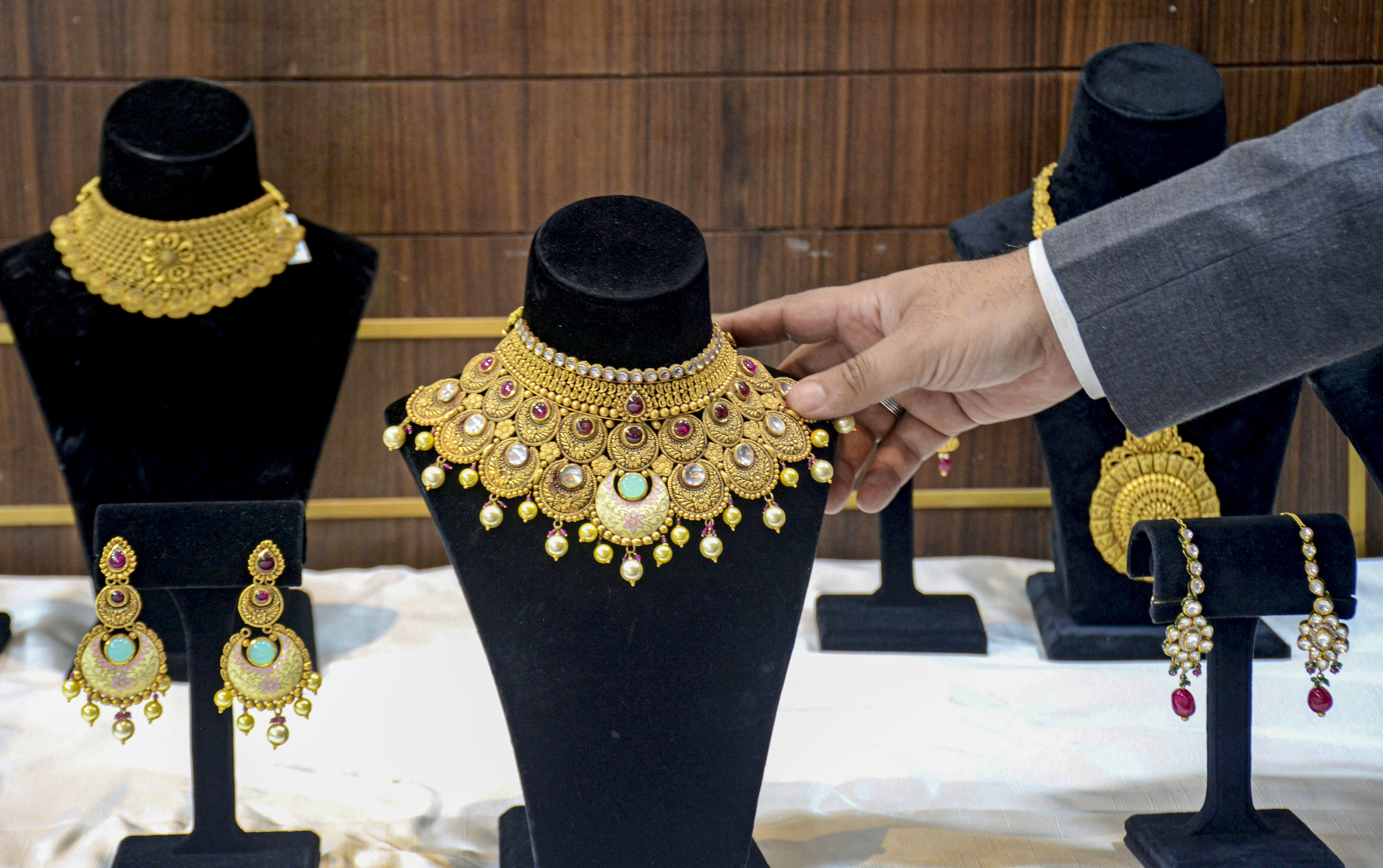 Gold rises in futures trade as investors seek safety amid global ...