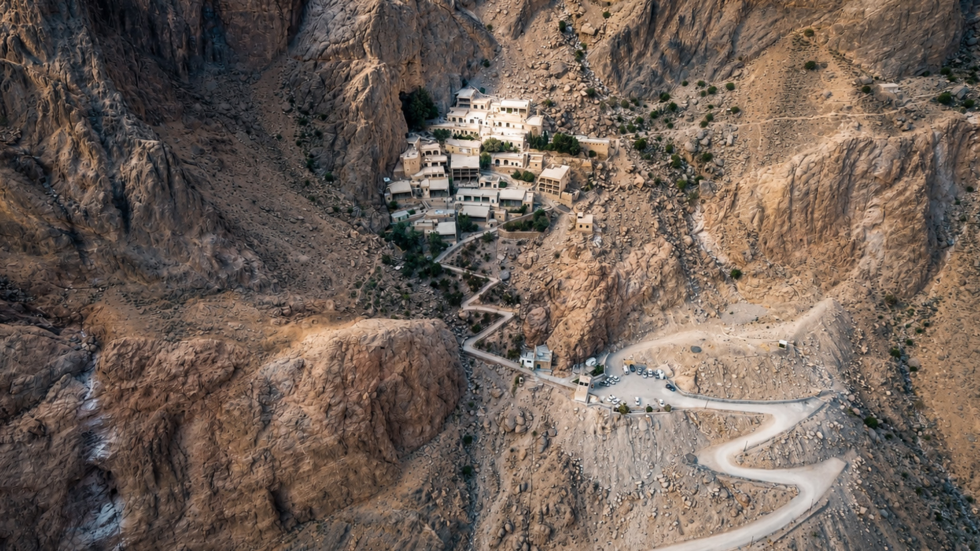 A desert settlement hidden between cliffs