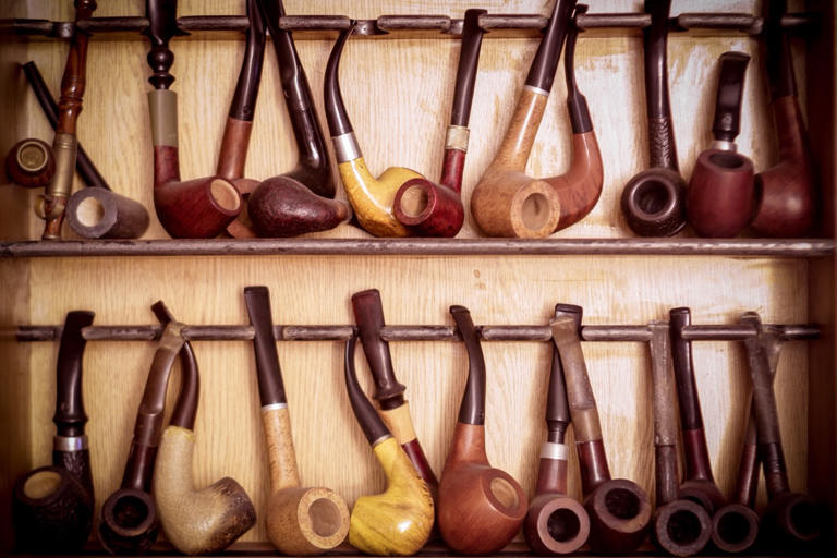 Why are these antique pipes shaped like human hands?