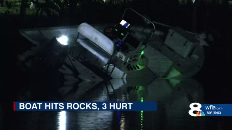 Bystander helps pull two men out of water after 19-foot vessel runs ashore