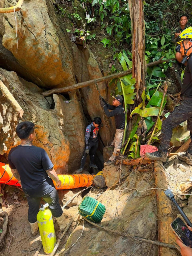 Rescuers race to reach 7 trapped in a Laos cave after flash floods ...