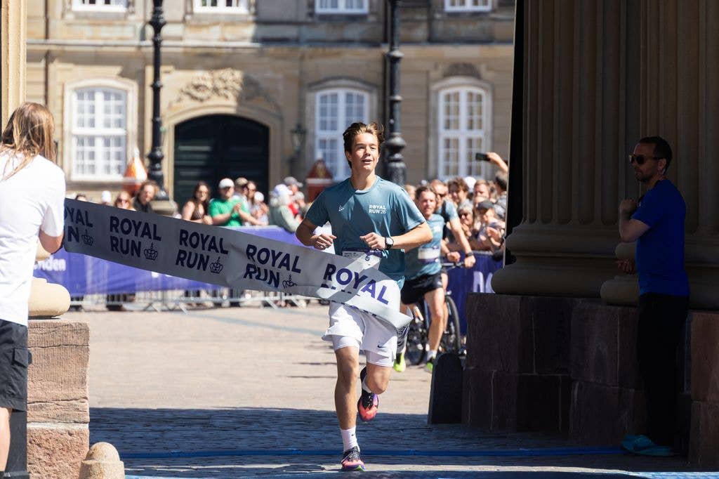 Competitive Queen Mary limbers up as she joins King Frederik and their ...