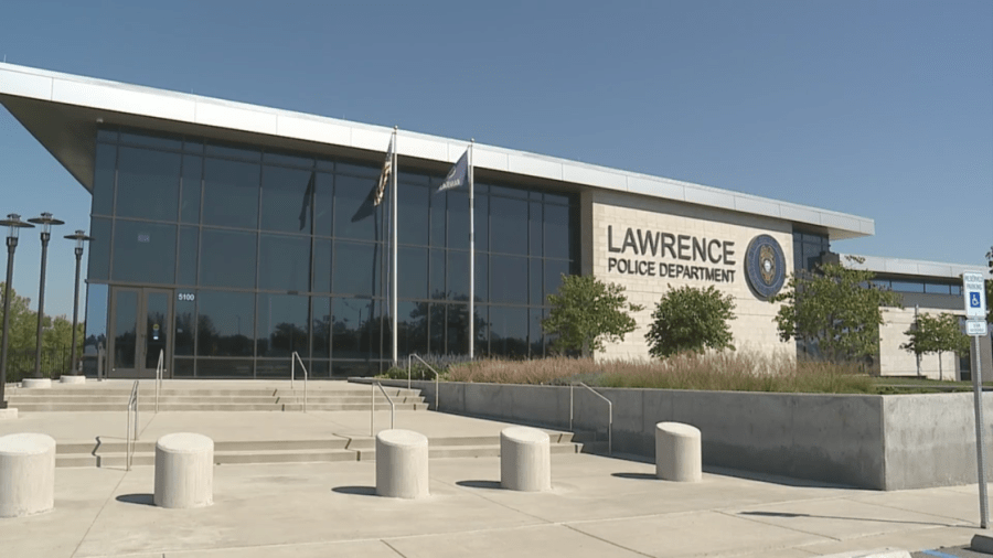 Lawrence woman tackles car burglar, holds him in leg lock