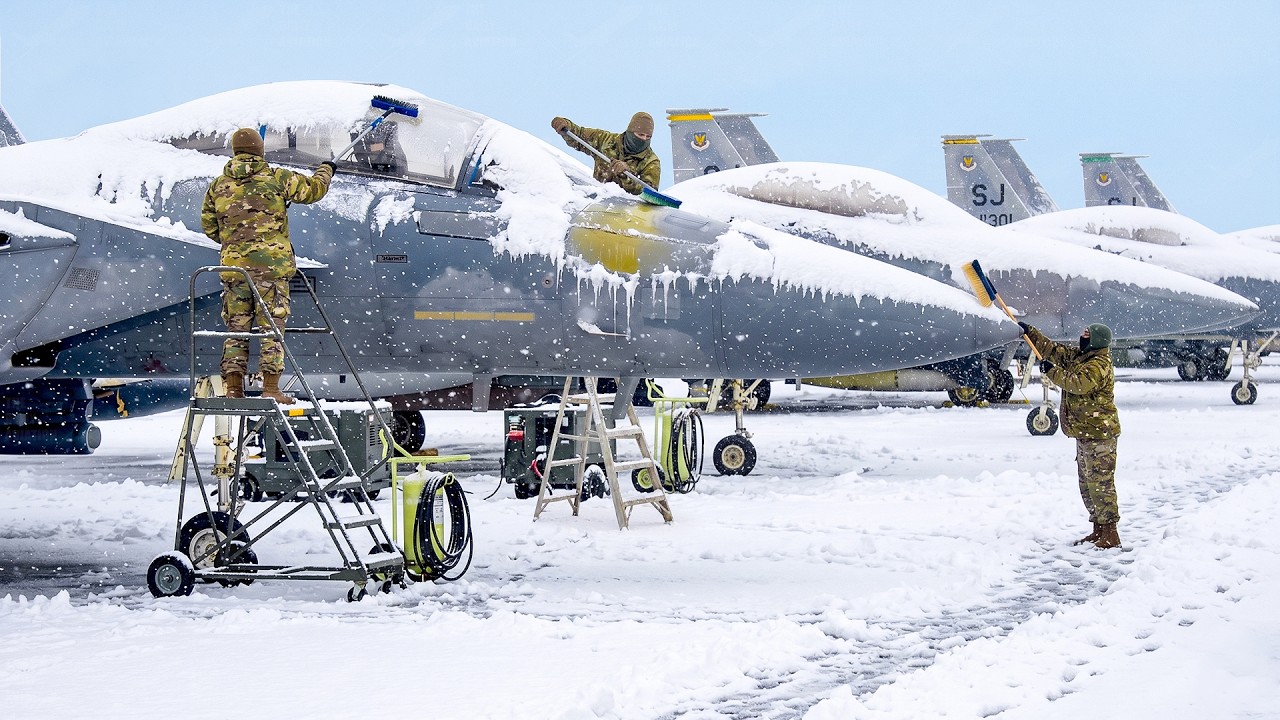 Inside frozen US air base starting gigantic ice-covered F-15s