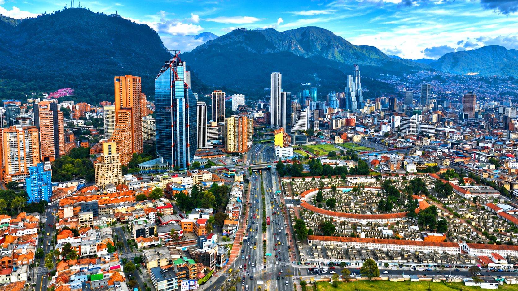 A mountain city surrounded by towering peaks