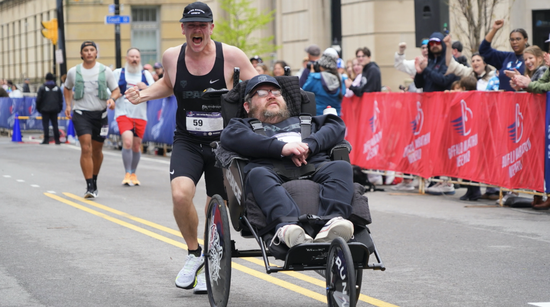 Buffalo twins complete marathon in race chair for muscular dystrophy ...