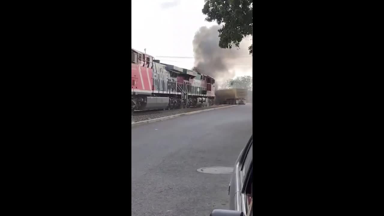 Freight train crashes into burning trailer during cartel roadblocks in ...