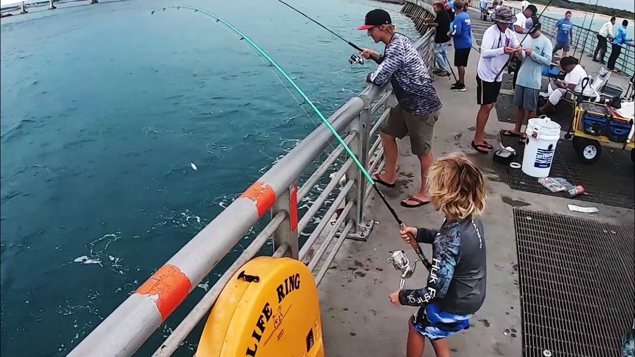 Kid hooks a monster fish and it almost pulled him in - caught on camera