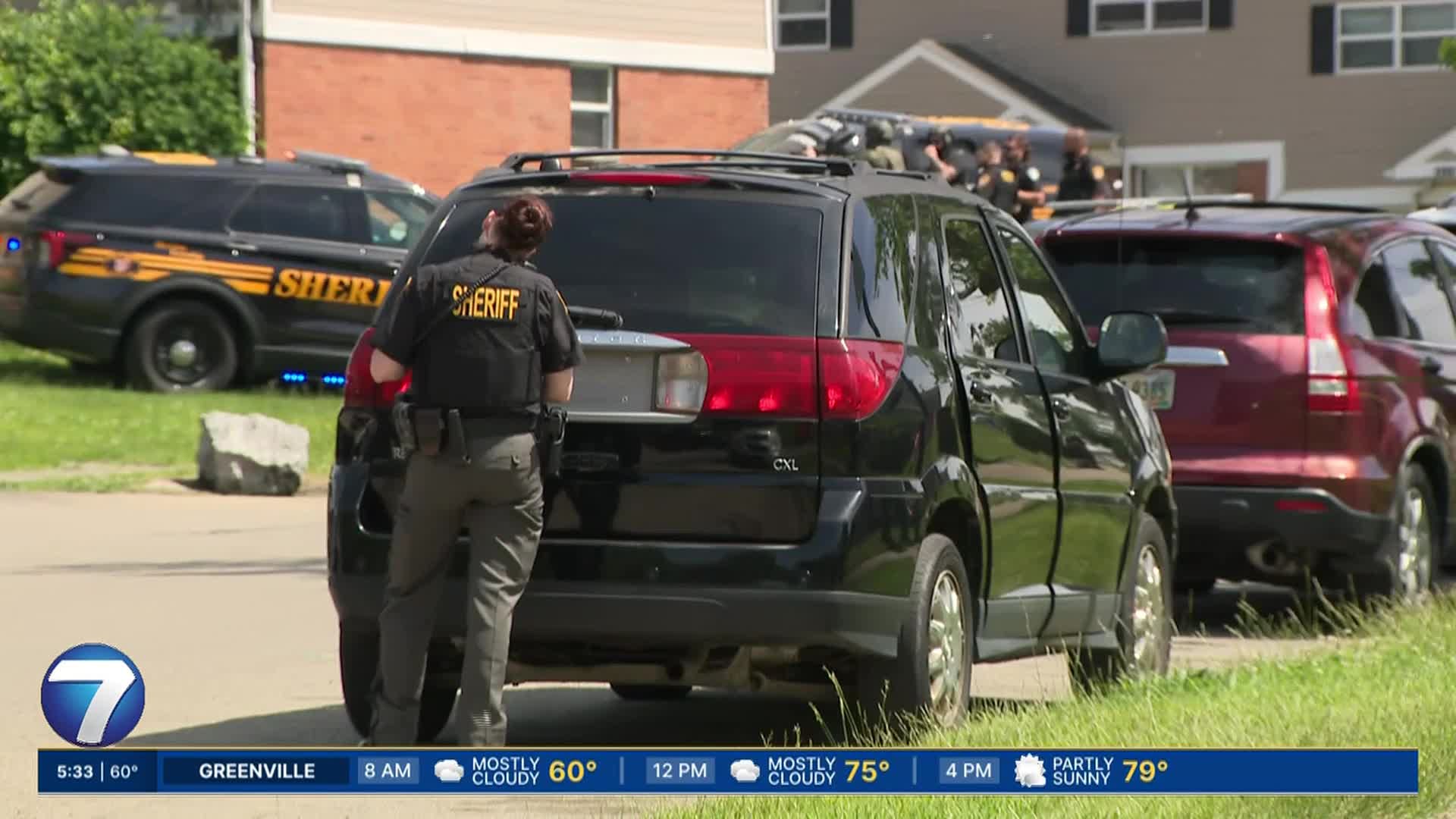 Police searching for suspects after robbery, SWAT standoff