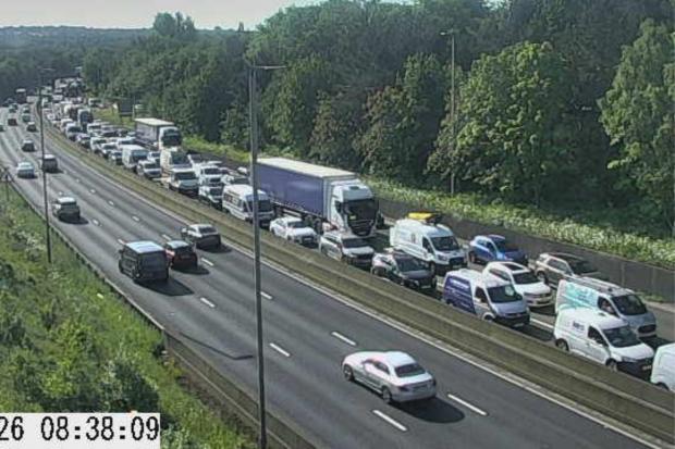 Patient taken to hospital after car crashes into central reservation on A1