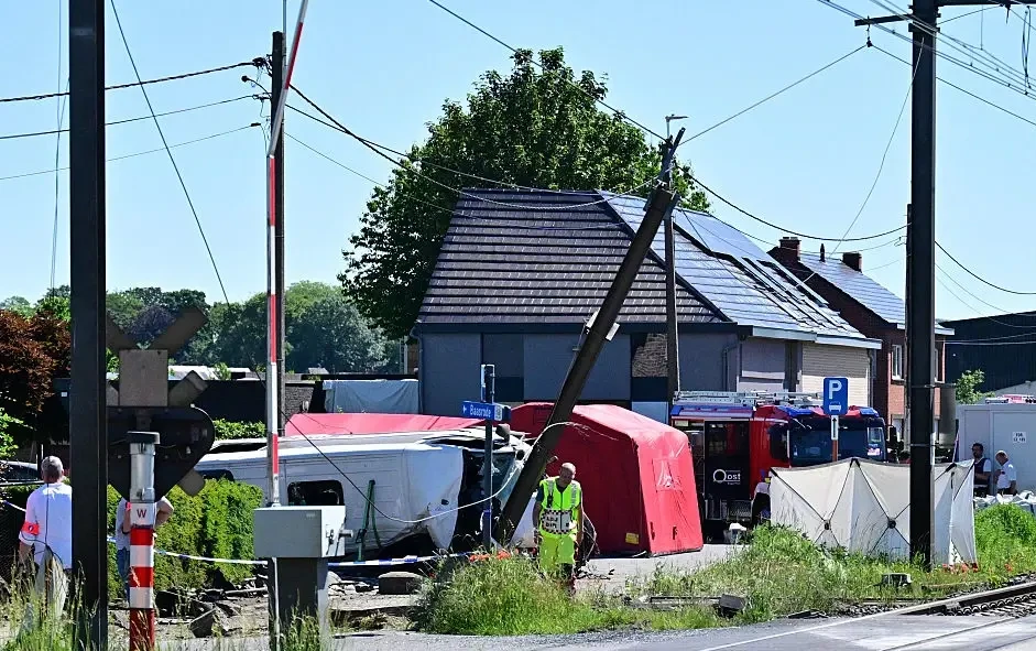 Four killed as train strikes school bus in Belgium