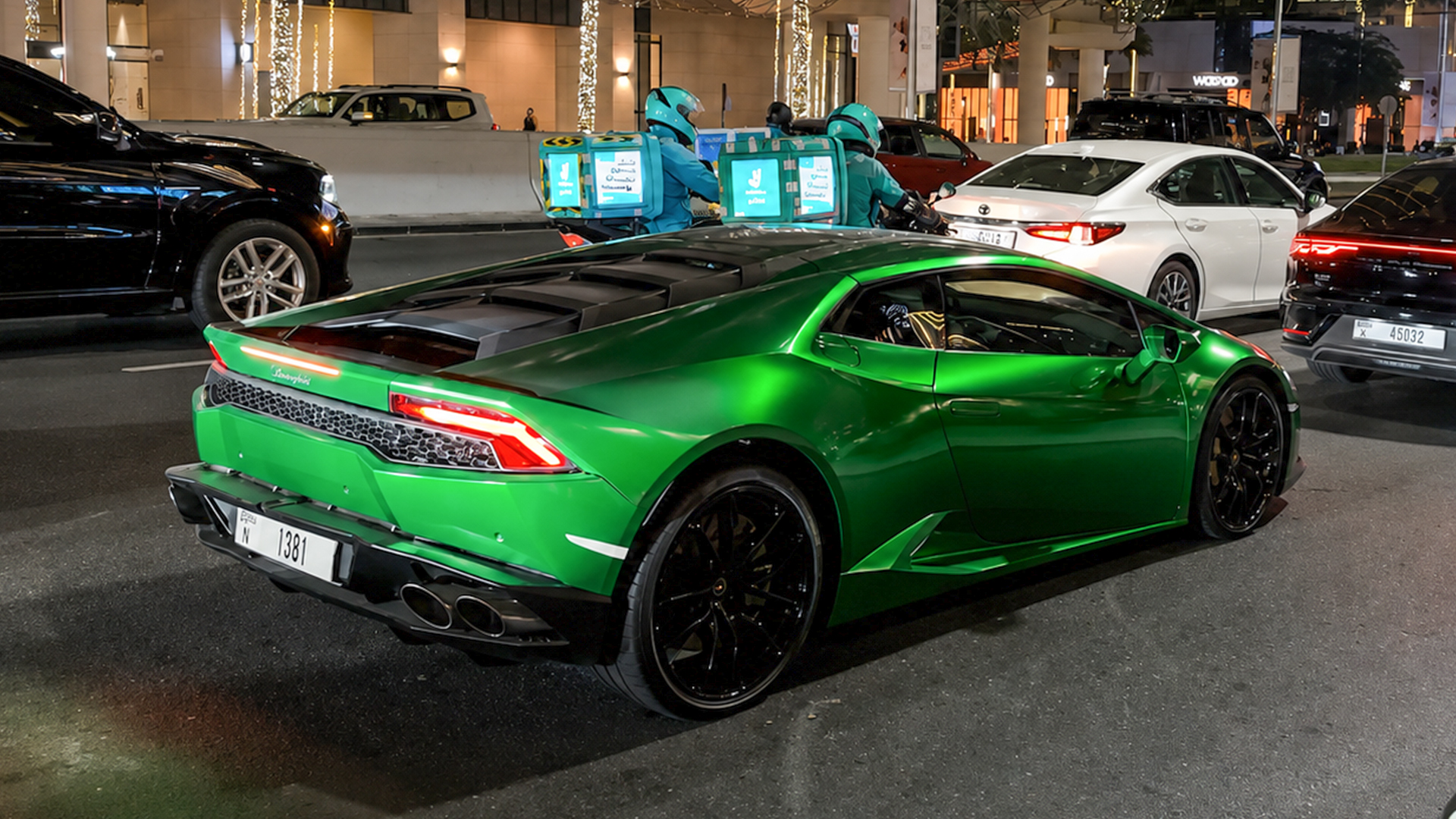 Dubai millionaire driving bright green Lamborghini Huracan