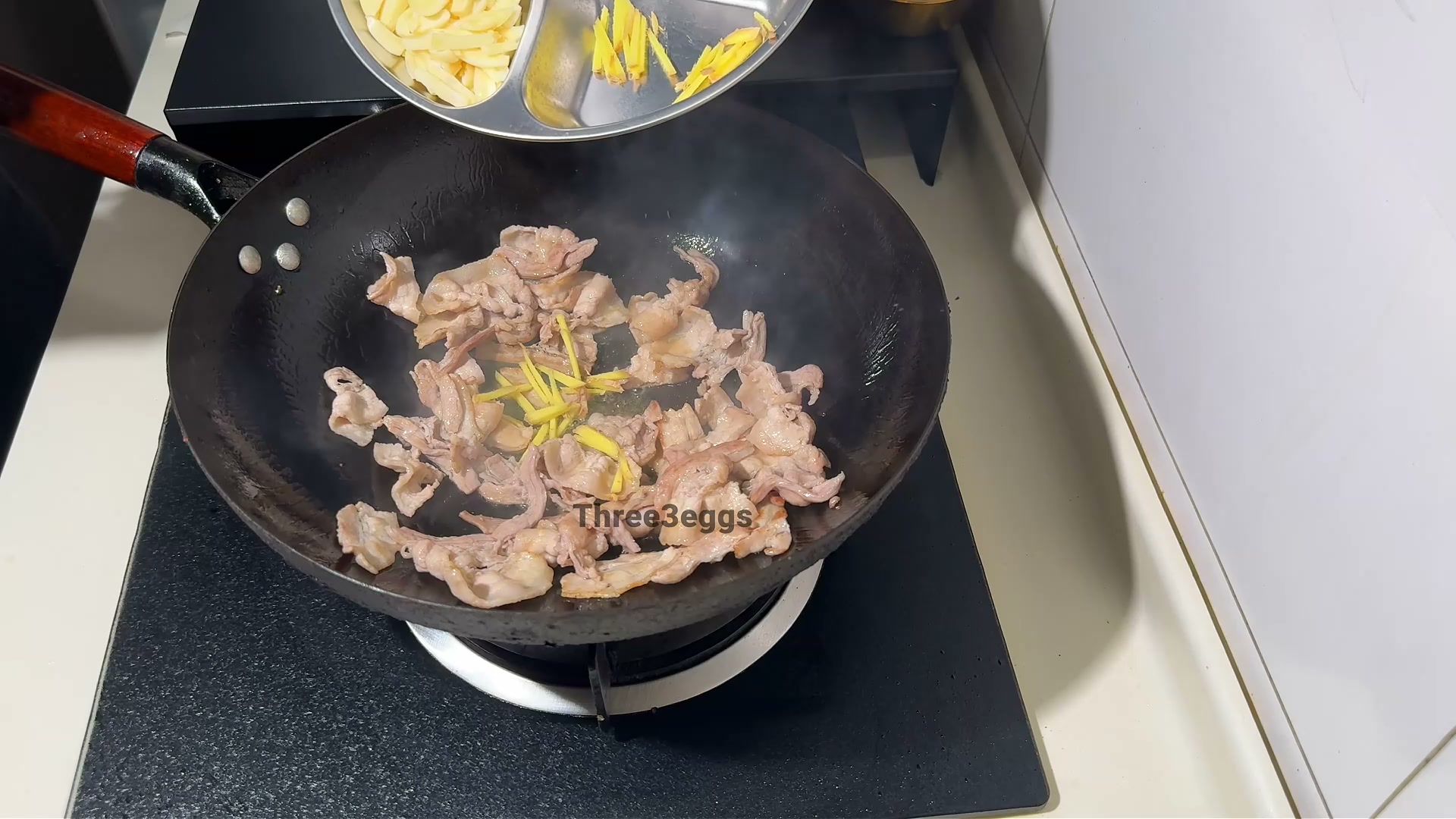 Crispy potatoes and savory pork cooked in one wok
