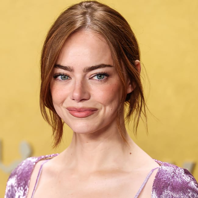 Emma Stone poses in all-black at the Louis Vuitton cruise show