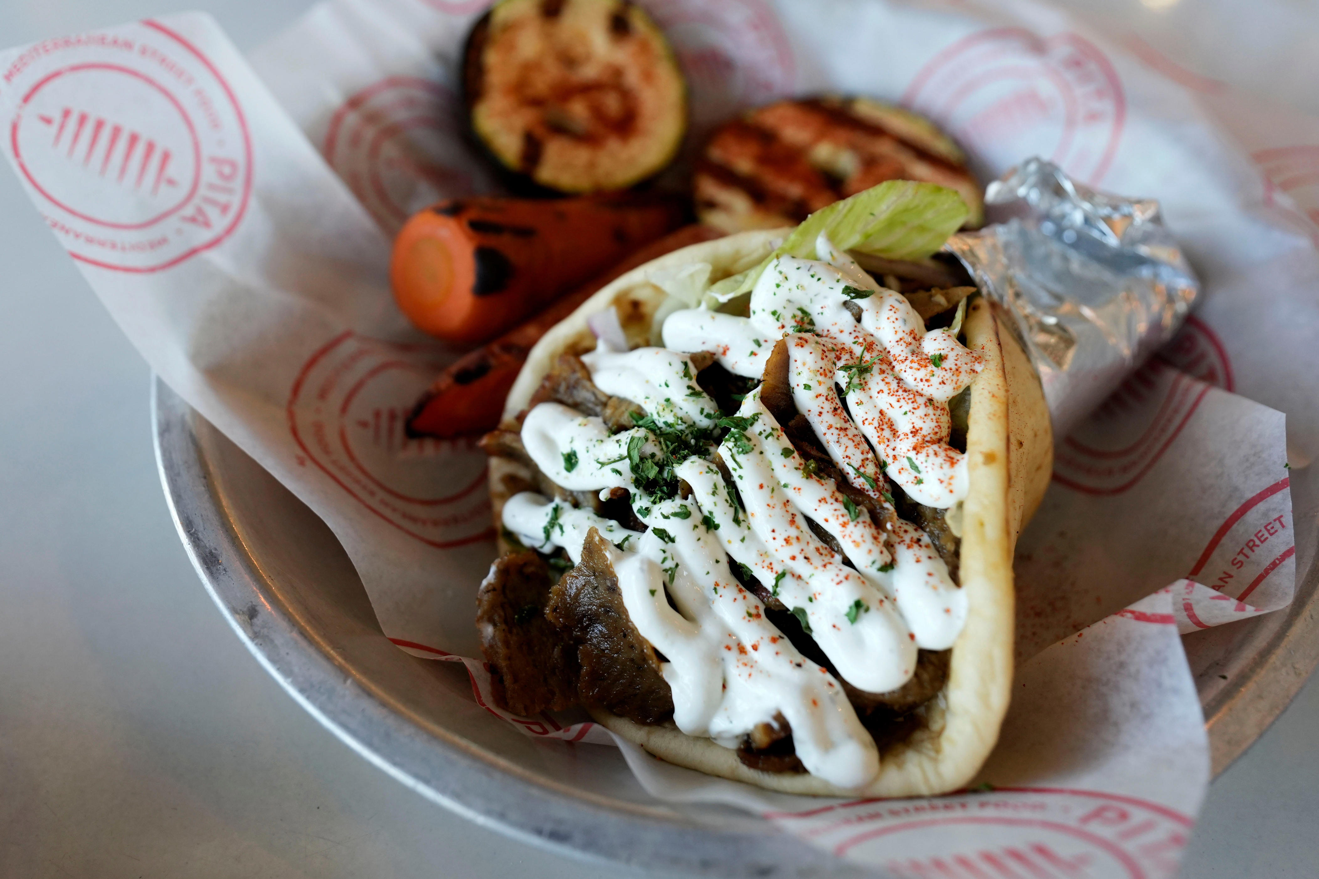 Augusta fathers bridge divide to co-own Pita Mediterranean Street Food