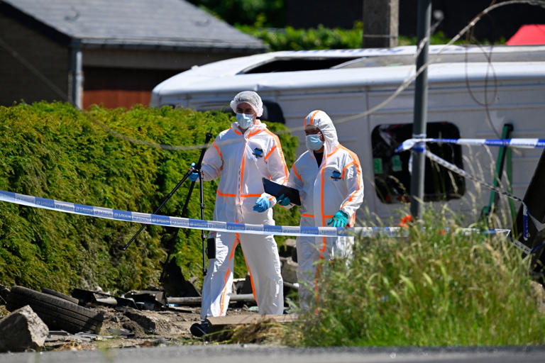 Two teenagers among four dead after train collides with school bus