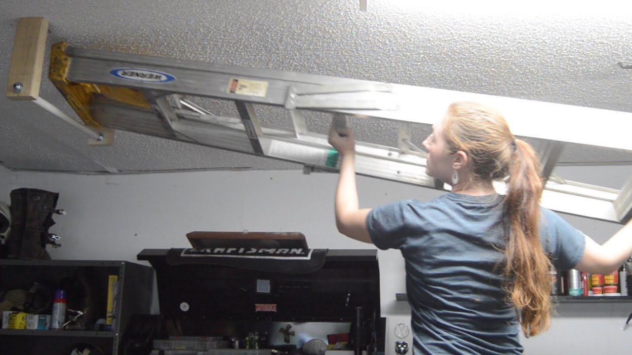 Clear floor space by hanging your ladder from the ceiling