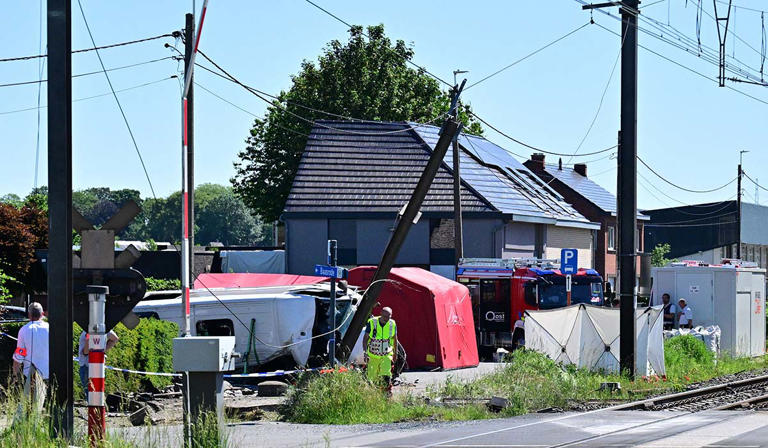 Four dead after school bus crashes into train at level crossing