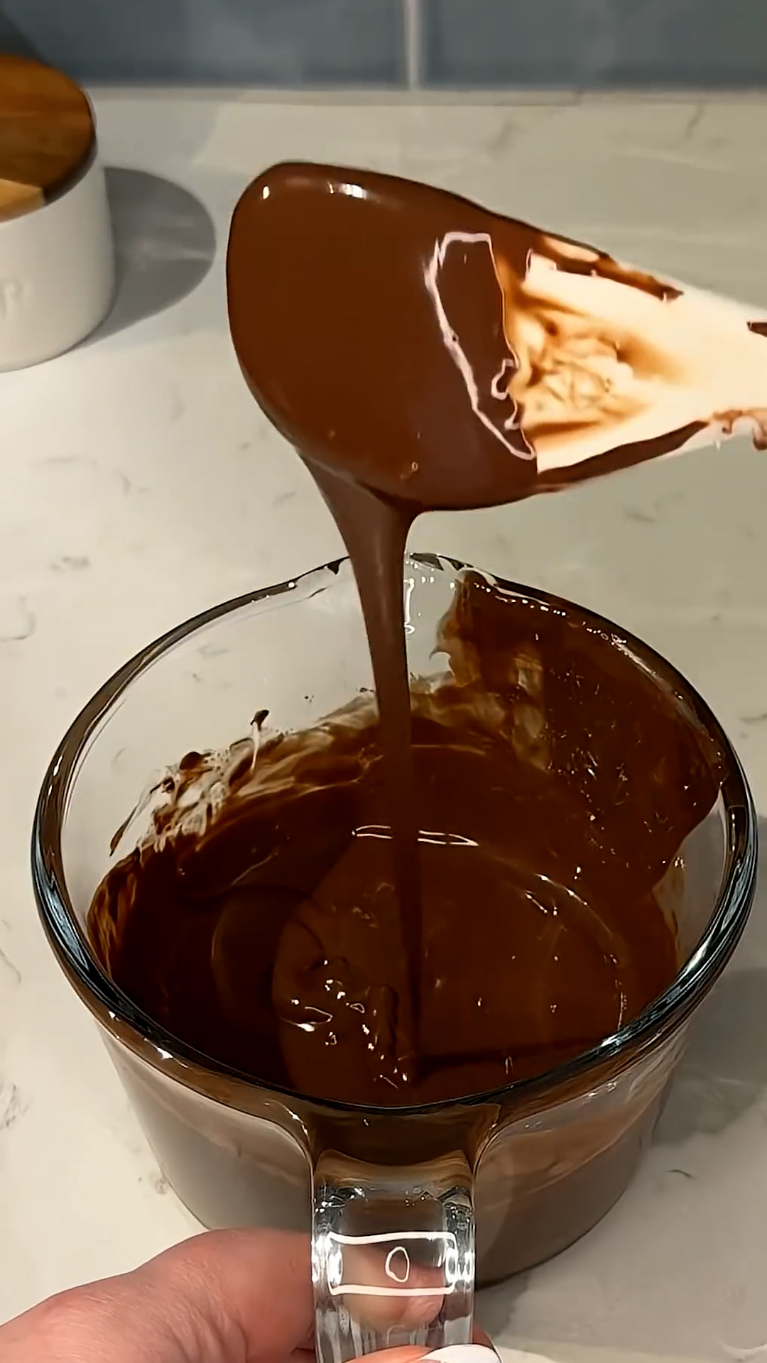 Popped kernels coated in chocolate brownie-flavored mixture