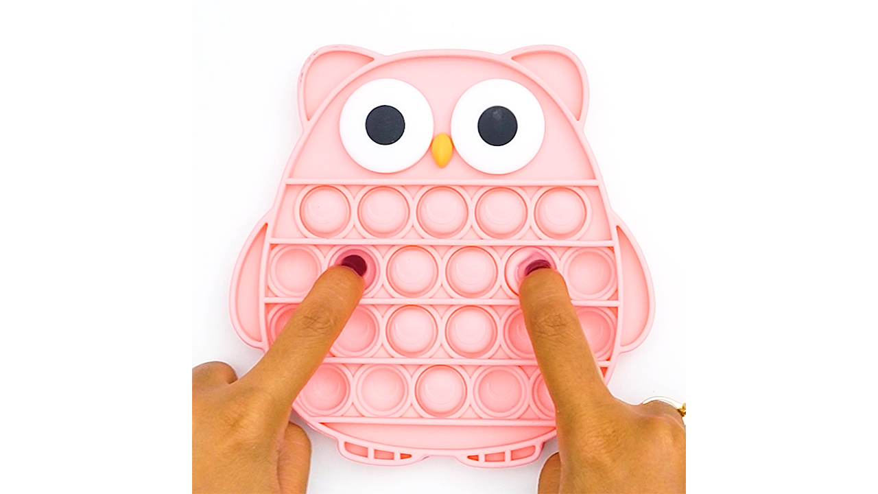 Popping a cute owl fidget toy with satisfying bubble presses