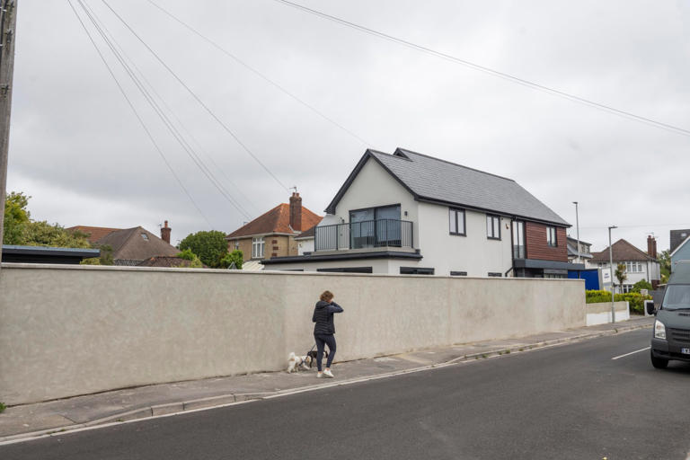 Dorset homeowner builds 7ft concrete 'Berlin Wall' outside £1,000,000 ...
