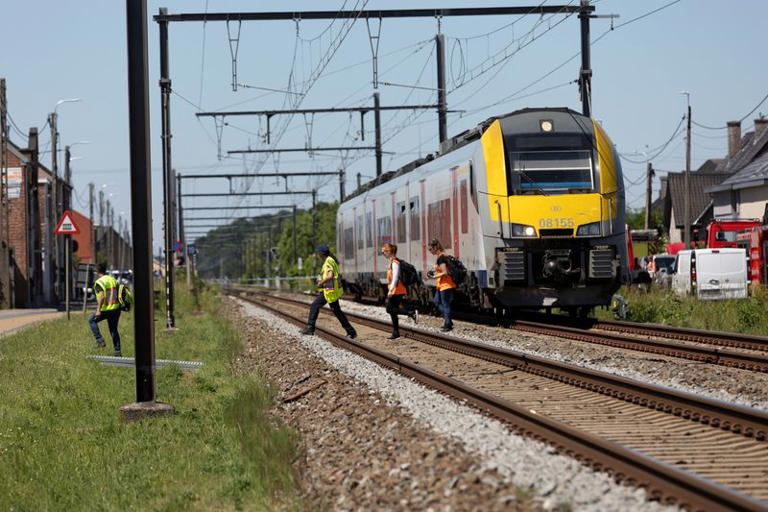 Train collides with school van in Belgium, killing four