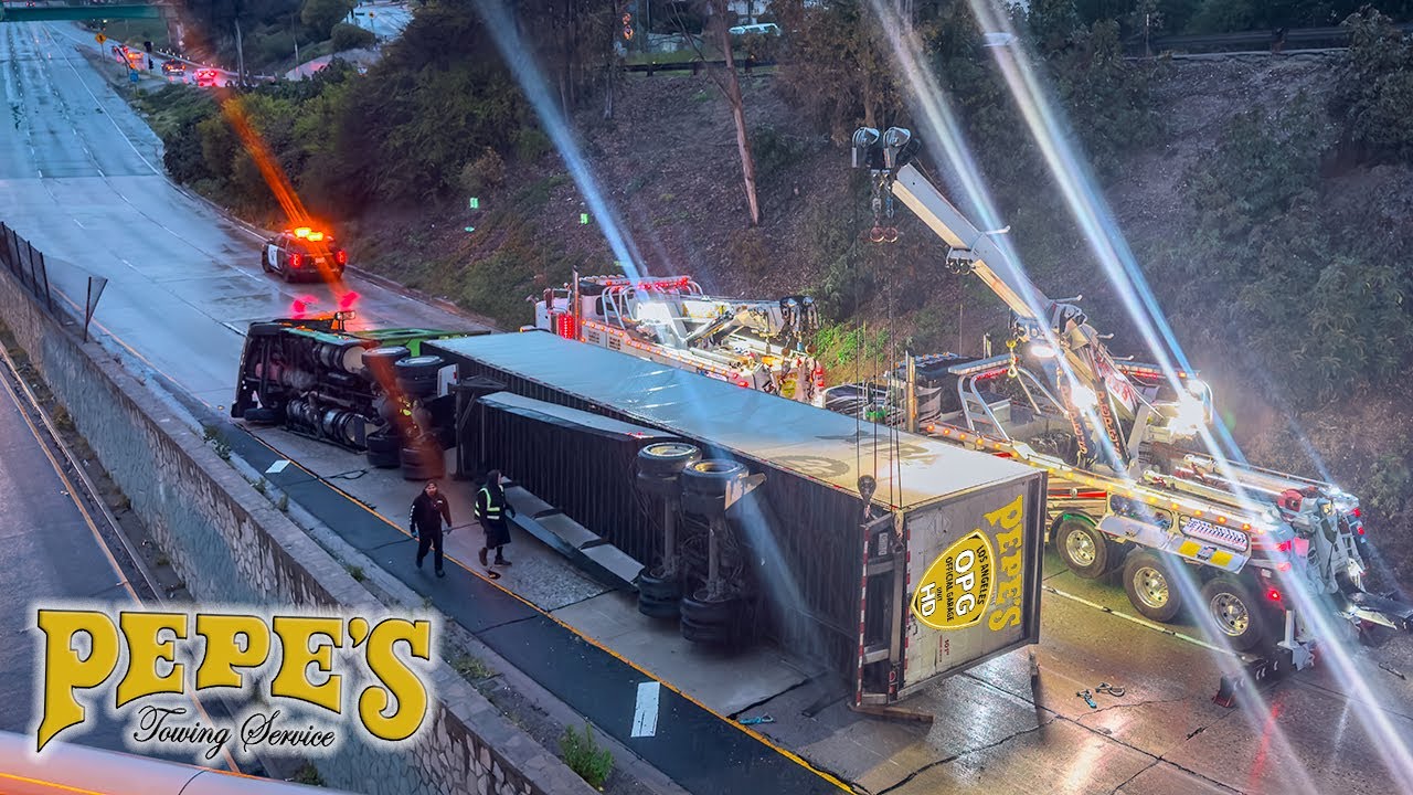 Freeway shut down for a loaded tractor trailer rollover: Heavy rescue