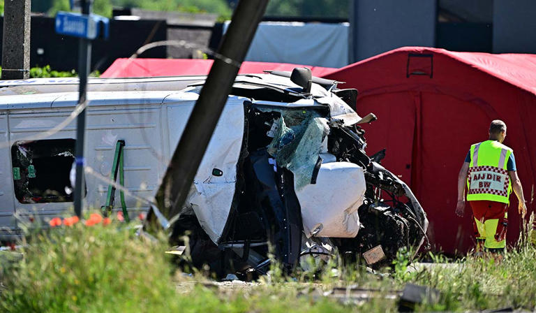 Four dead after school bus crashes into train at level crossing