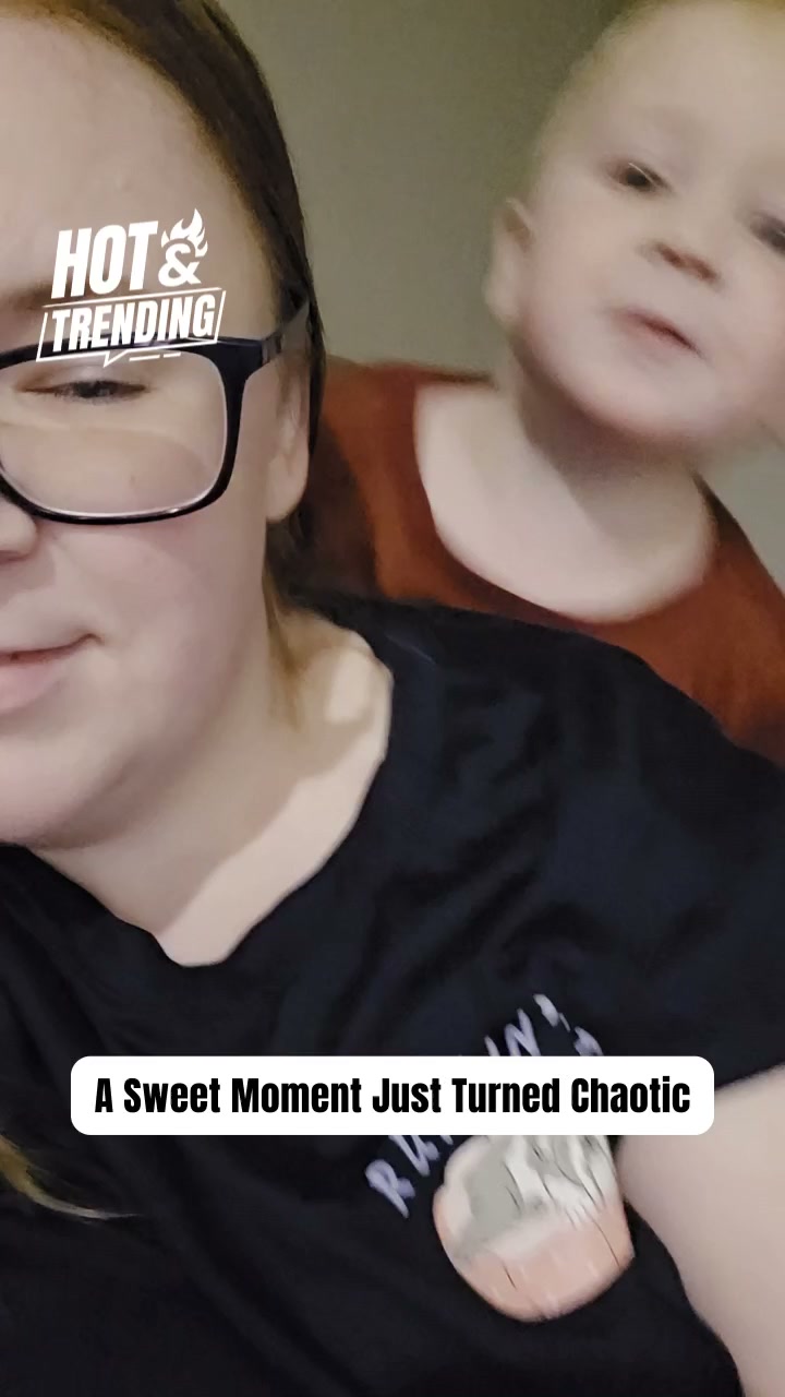 Young boy leans on his mother and unexpectedly slaps her