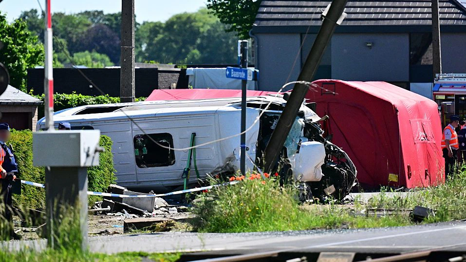 Four killed as train strikes school bus in Belgium
