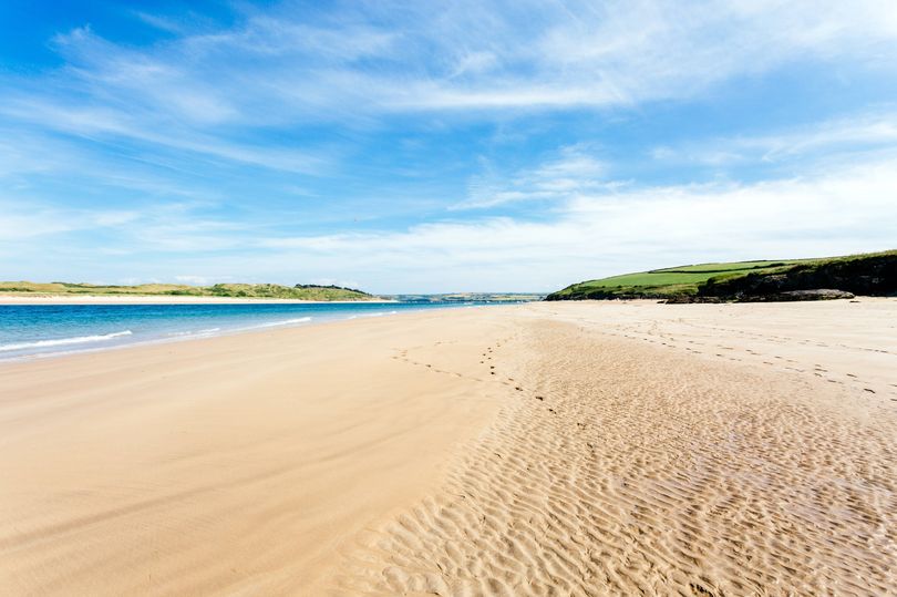 Cornwall beach tragedy as man dies trying to save family members in water