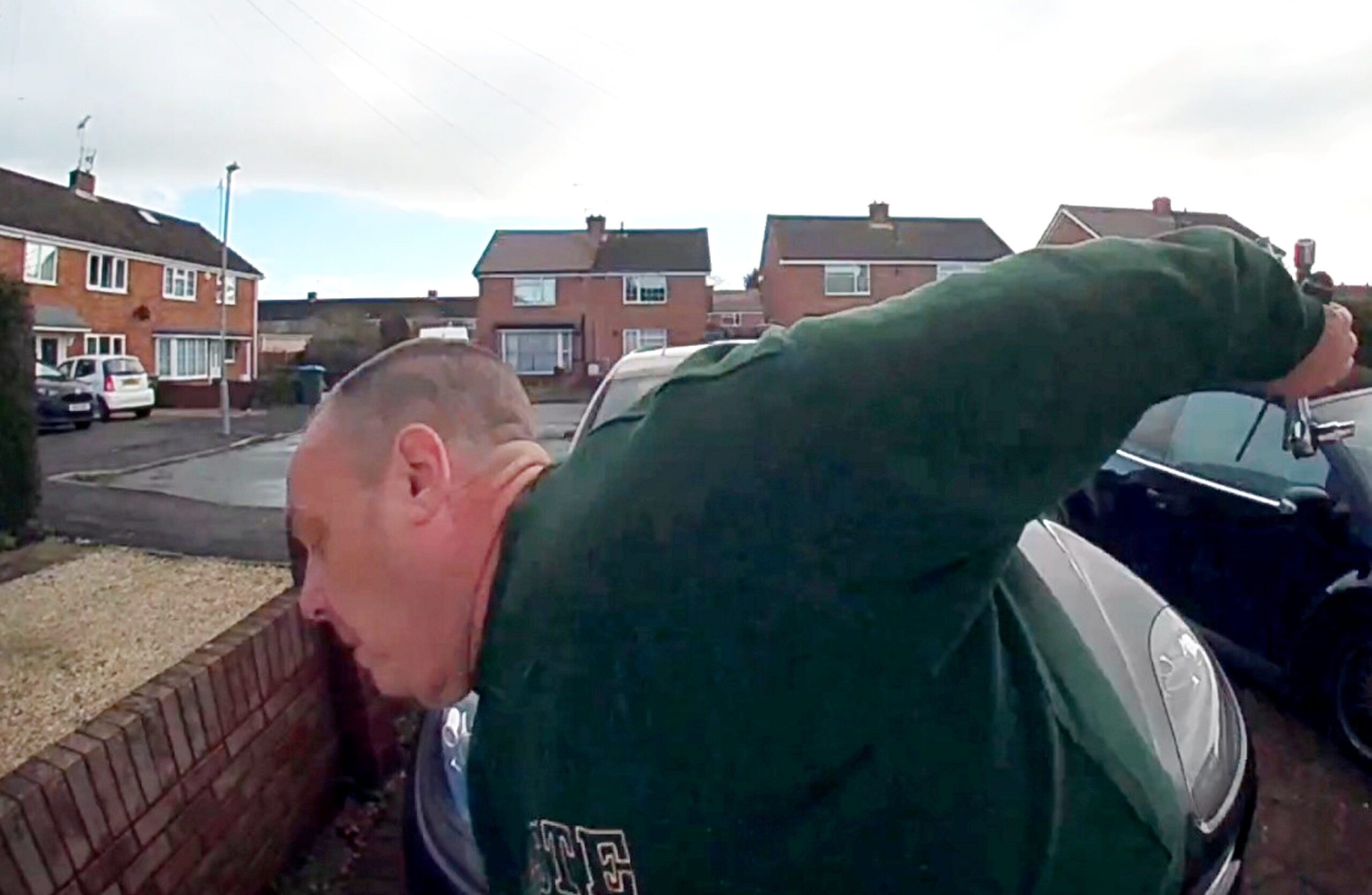 Dad caught on doorbell cam falling through garden wall