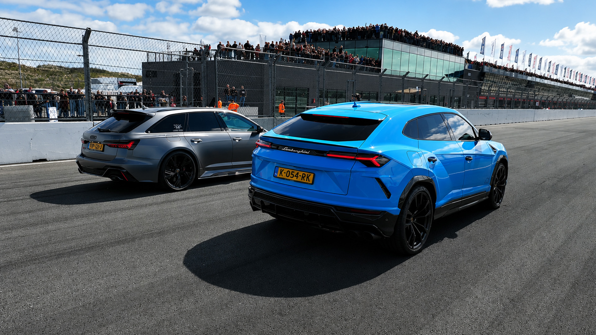 Which car pulls ahead in this race? Lamborghini Urus or Audi RS6?