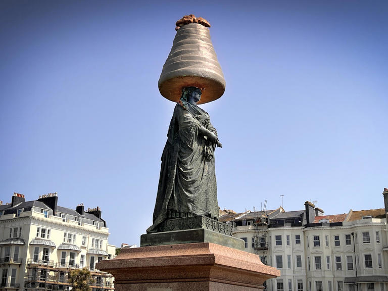 Giant Walnut Whip appears on Queen Victoria statue on Hastings seafront