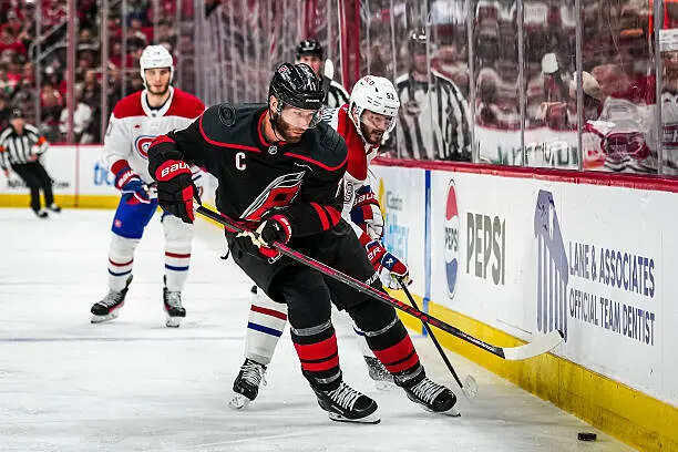 Montreal Canadiens defenseman Noah Dobson hit on Carolina Hurricanes ...
