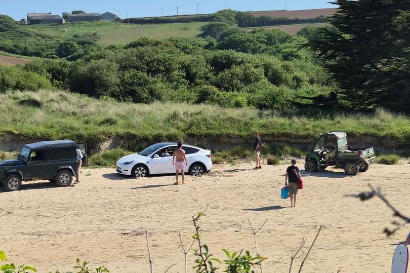 Tesla-driving 'moron' parks right on Cornish beach and gets stuck